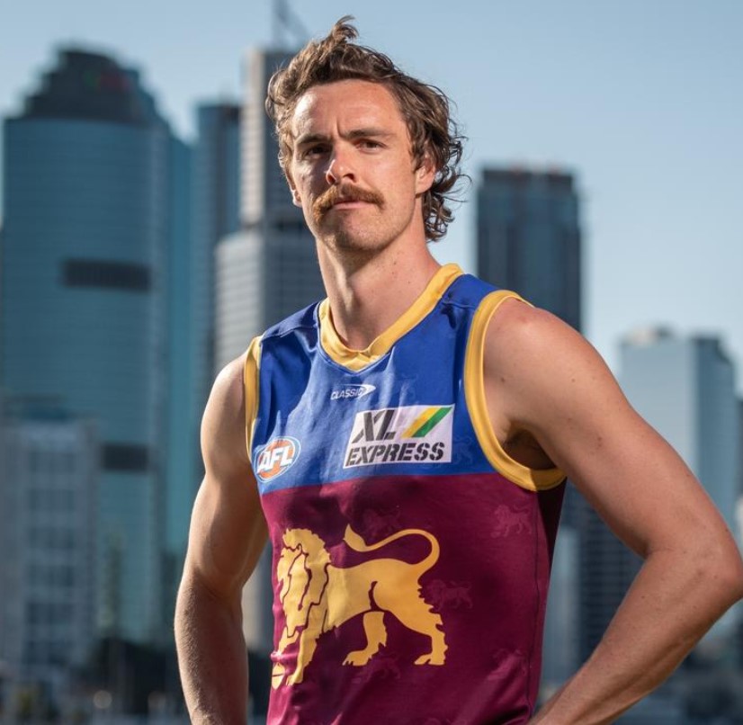 Joe Daniher, a forward for the Brisbane Lions, leaves the game quickly ...